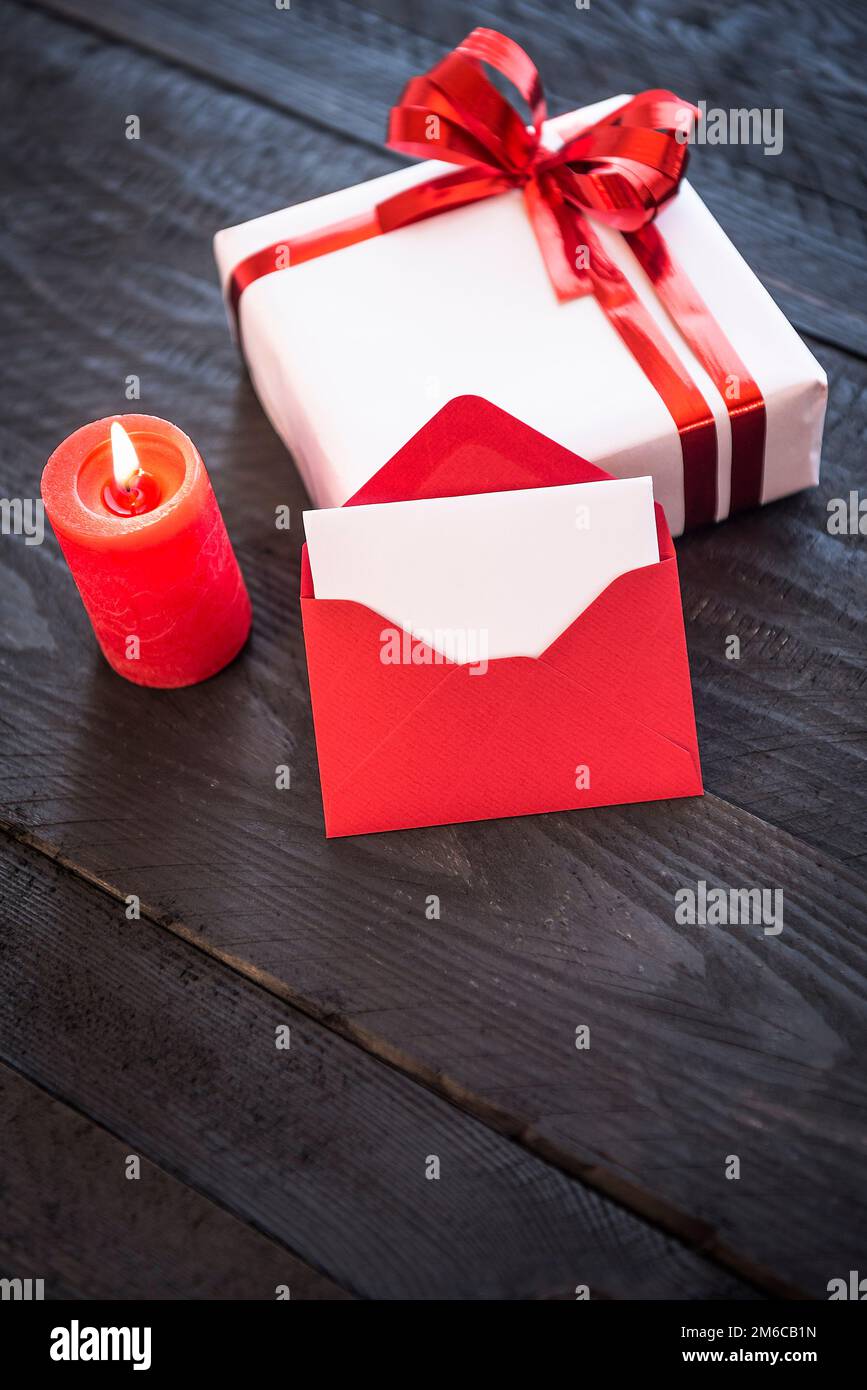 Stylish present and empty red letter Stock Photo - Alamy