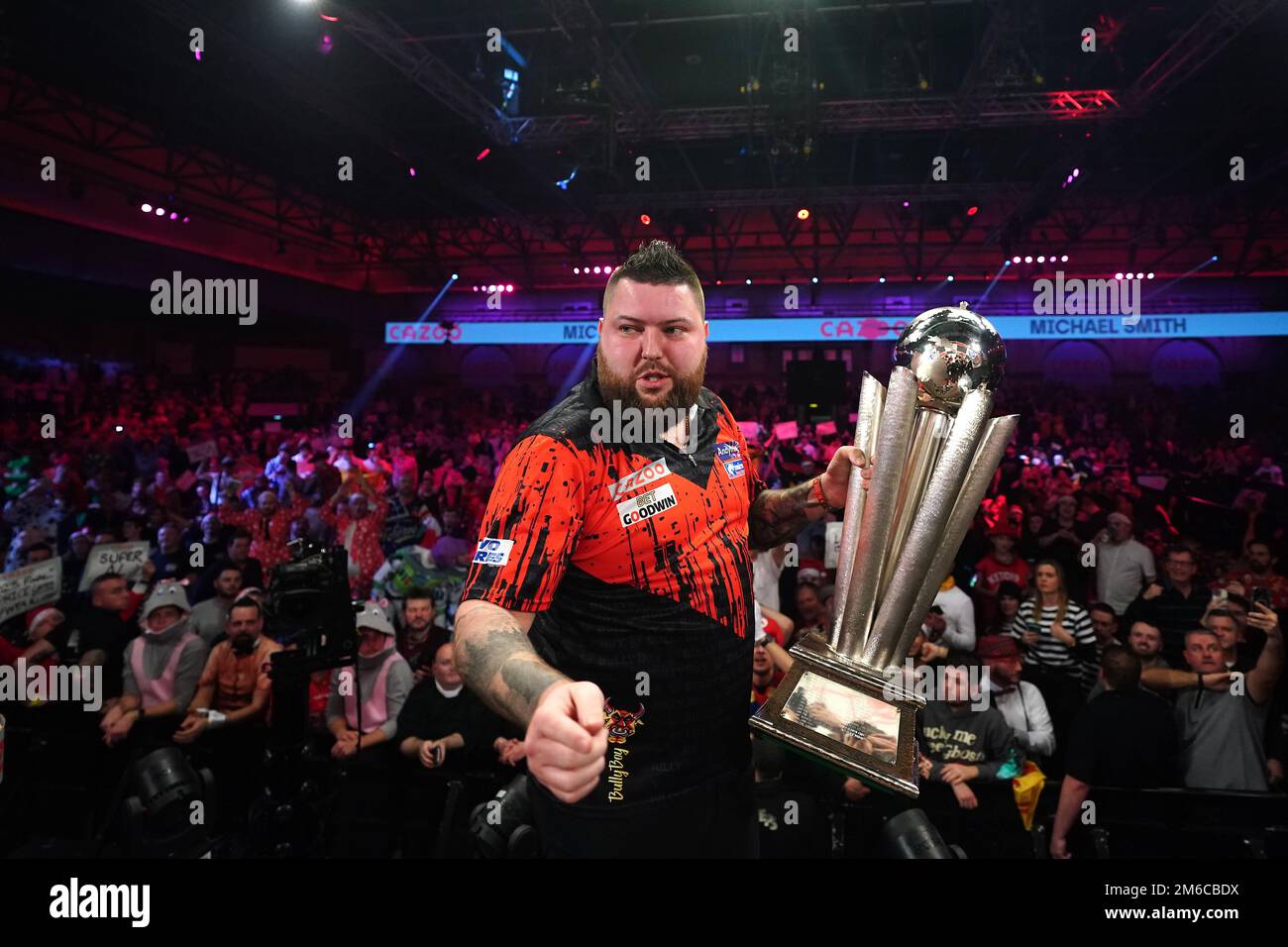 Michael Smith celebrates with the Sid Waddell trophy after winning the ...