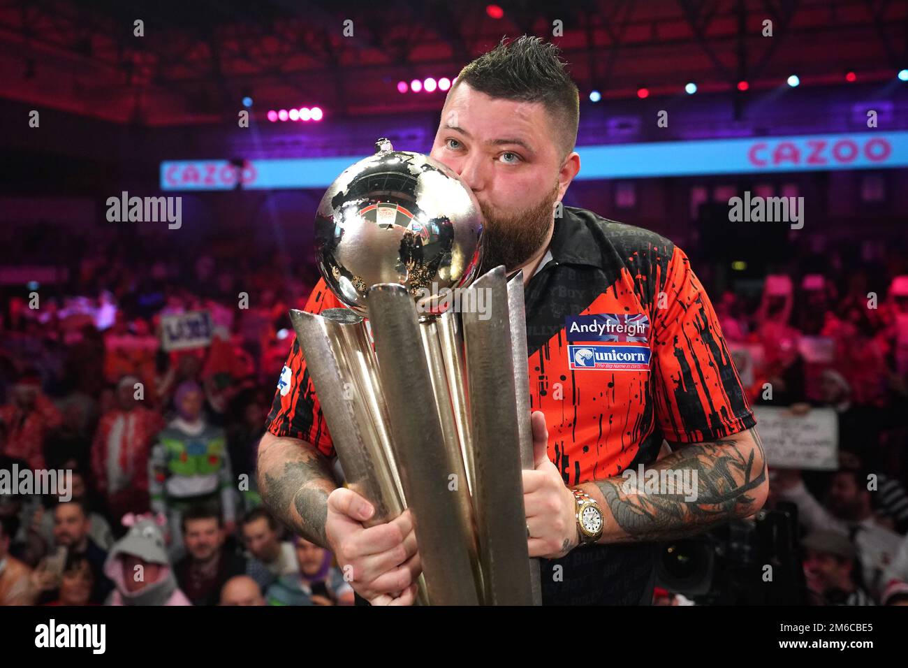 Michael Smith celebrates with the Sid Waddell trophy after winning the ...