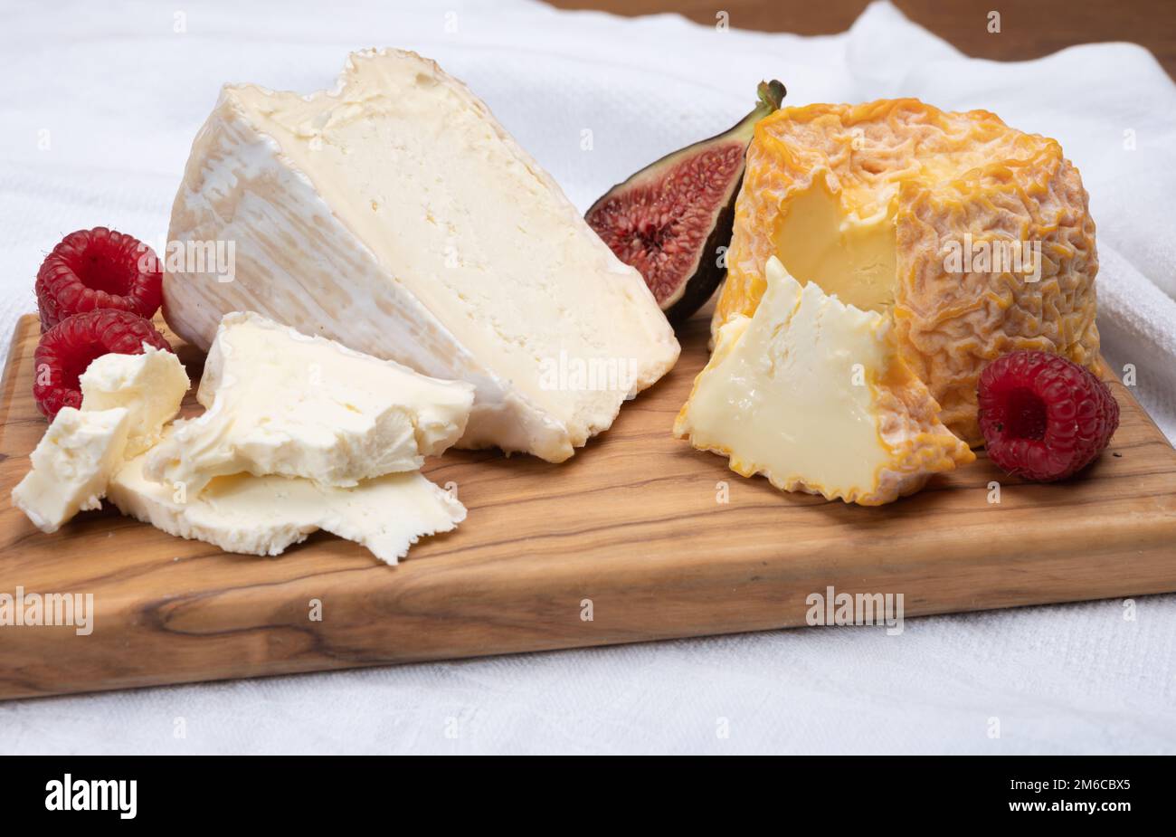 Board with french soft cheeses, Delice de Bourgogne French cow's milk ...