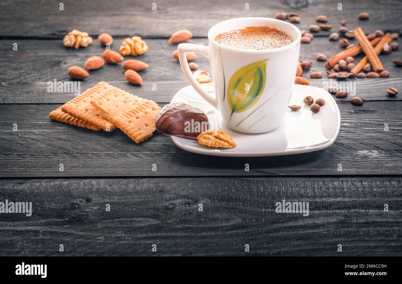 Cup of coffee and snacks Stock Photo - Alamy