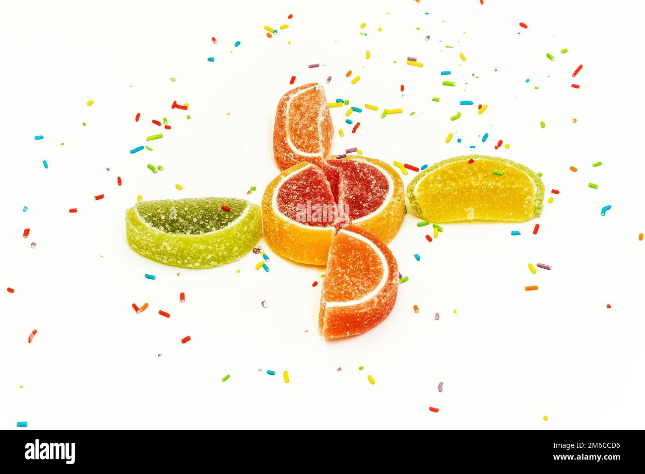 Confectionery sprinkling and citrus fruit wedges of marmalade on a ...