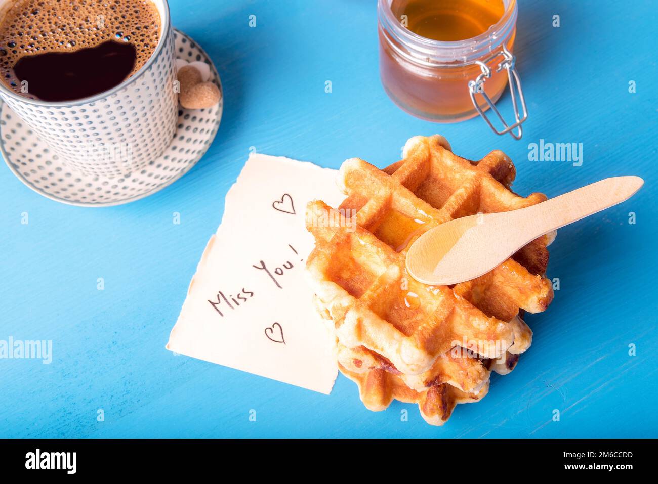 Waffles with honey and miss you message Stock Photo - Alamy