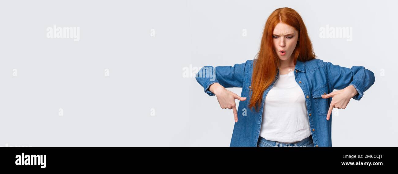 Wait a minute what is that. Frustrated and angry tensed redhead ...