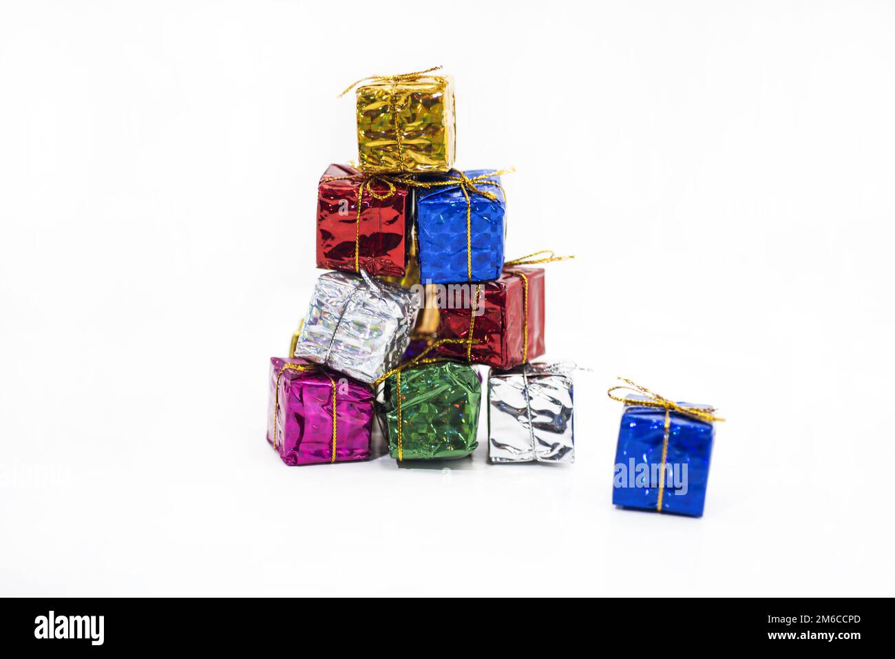 Small decorative presents on white table with Stock Photo - Alamy