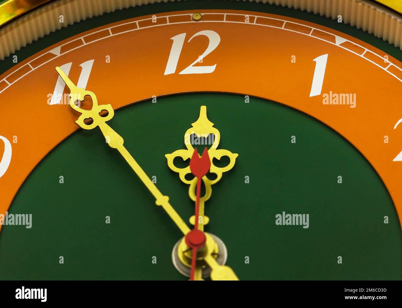 The clock shows the time of eleven hours and fifty-five minutes Stock ...