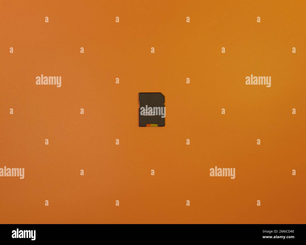 Micro SD card in a black adapter on an orange background Stock Photo ...