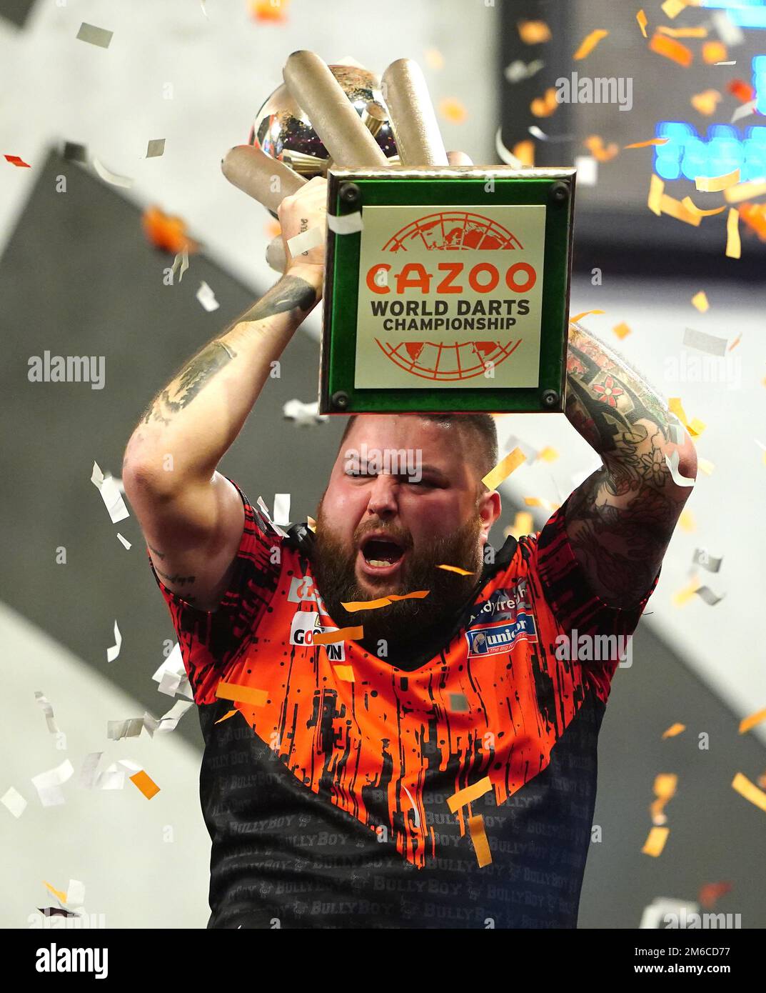 Michael Smith celebrates with the Sid Waddell trophy after winning the ...