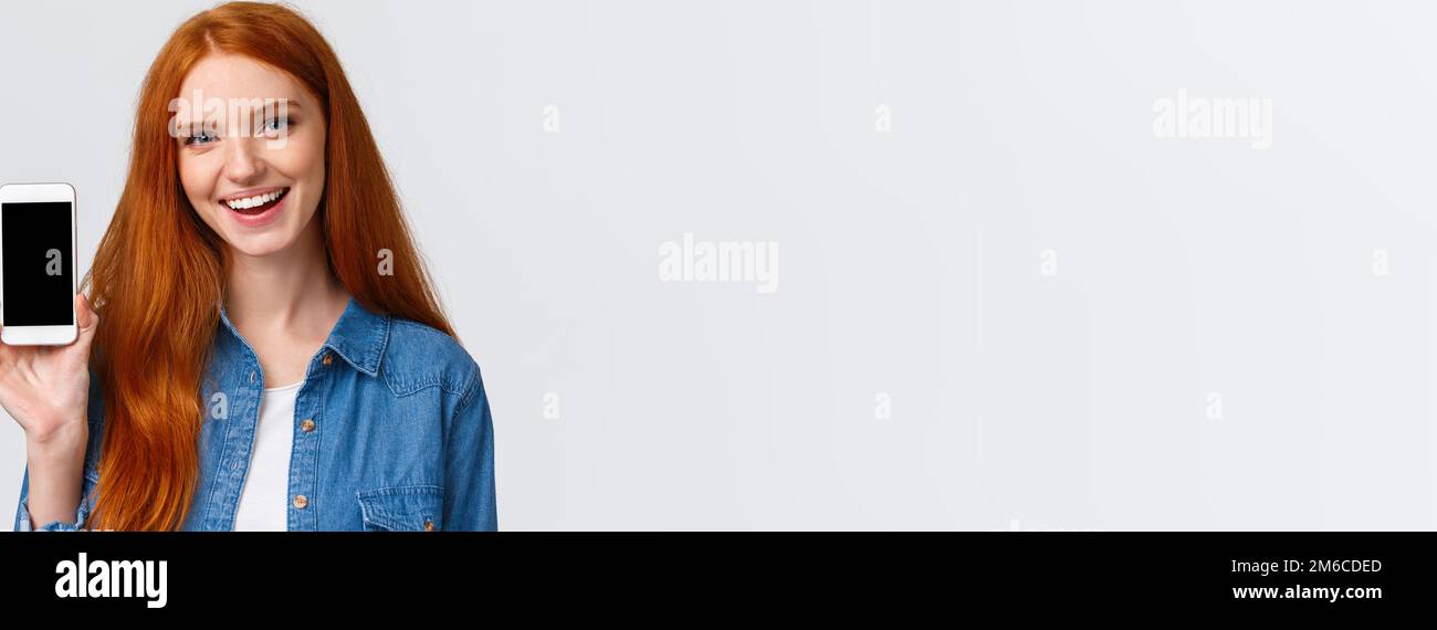 Close-up portrait modern millennial cute redhead female with blue eyes ...