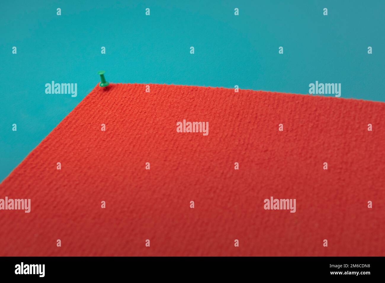 The red carpet is attached with push pins to the wall. Texture. Space ...