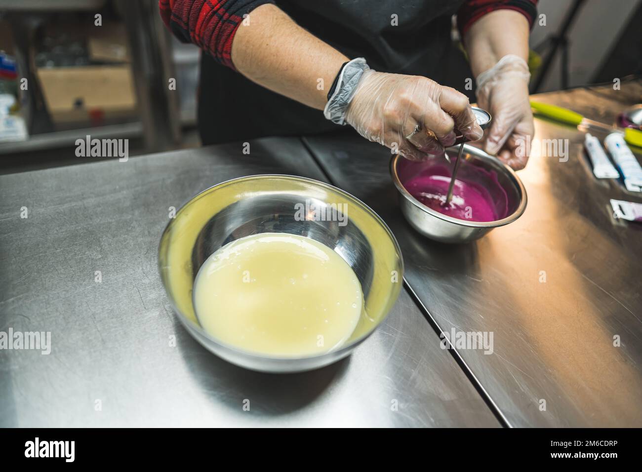 Food coloring in buttercream icing preparing process. Professional ...