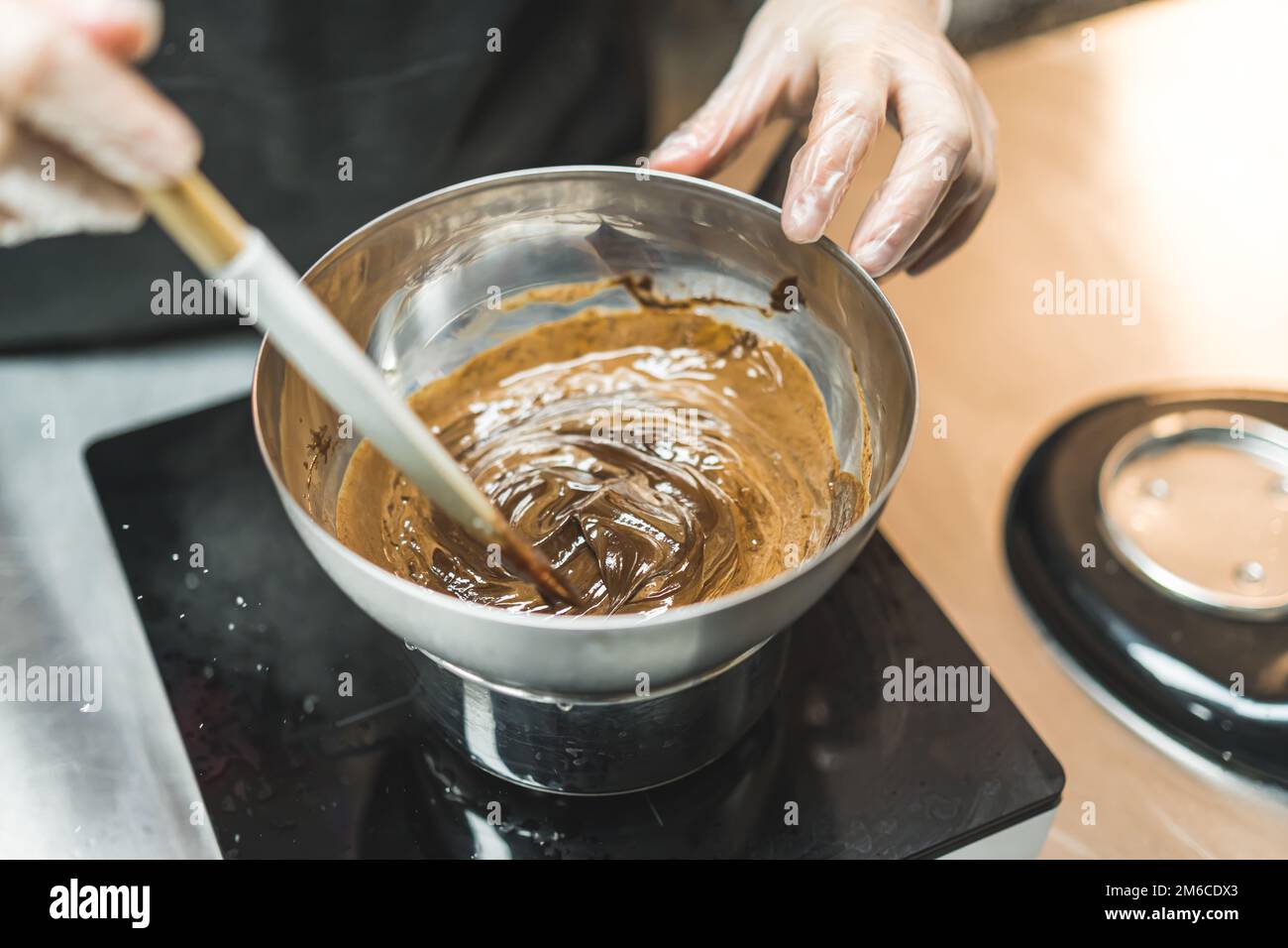 Chef melting milk chocolate hi-res stock photography and images - Alamy