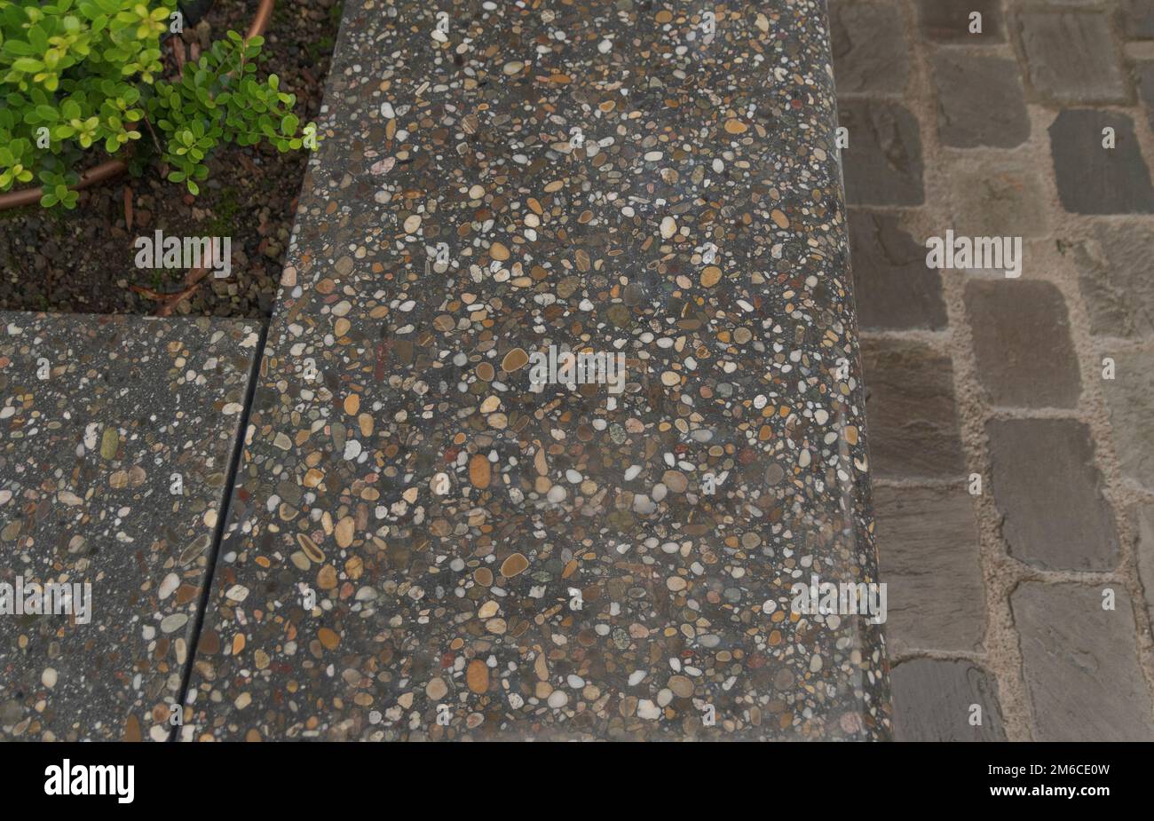 The texture of the wet stone of the flower bed after the rain Stock ...