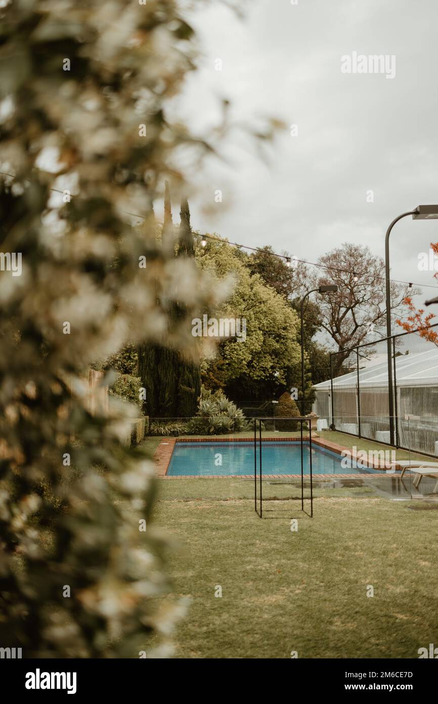 Backyard landscaping with bushes and pool in Australia Stock Photo - Alamy