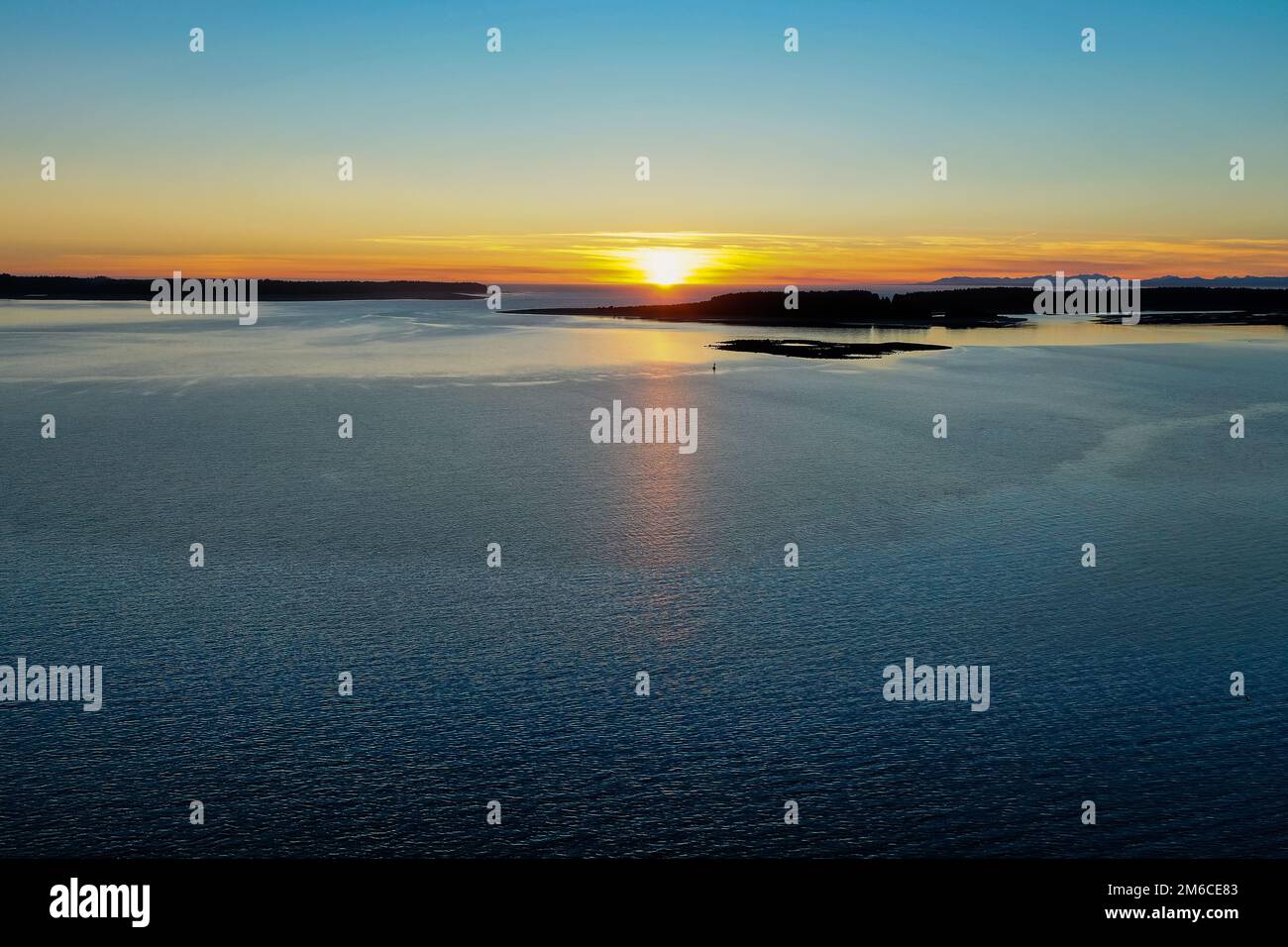 Sunset over ocean bay with blue and orange colors from drone Stock ...
