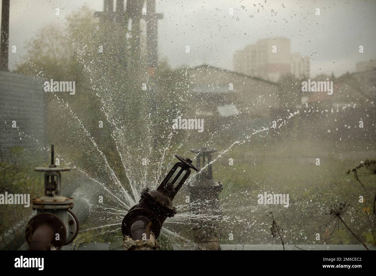 Pipeline accident. Water pours out of pipe. Emergency Stock Photo - Alamy