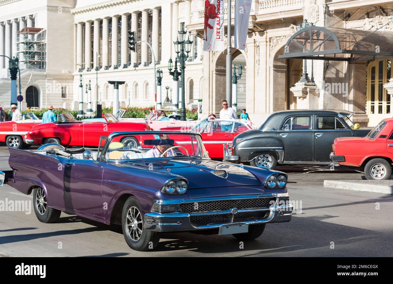 Merican purple convertible Ford classic car on the street near the ...