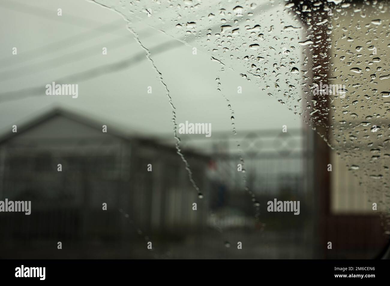 Raindrops on glass. Rainy weather outside window Stock Photo - Alamy