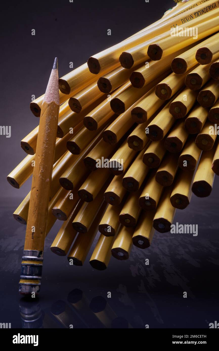 Cascading new pencils in concert with a sharpened one Stock Photo - Alamy