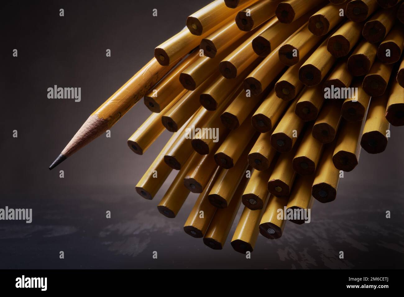 Cascading new pencils in concert with a sharpened one Stock Photo - Alamy