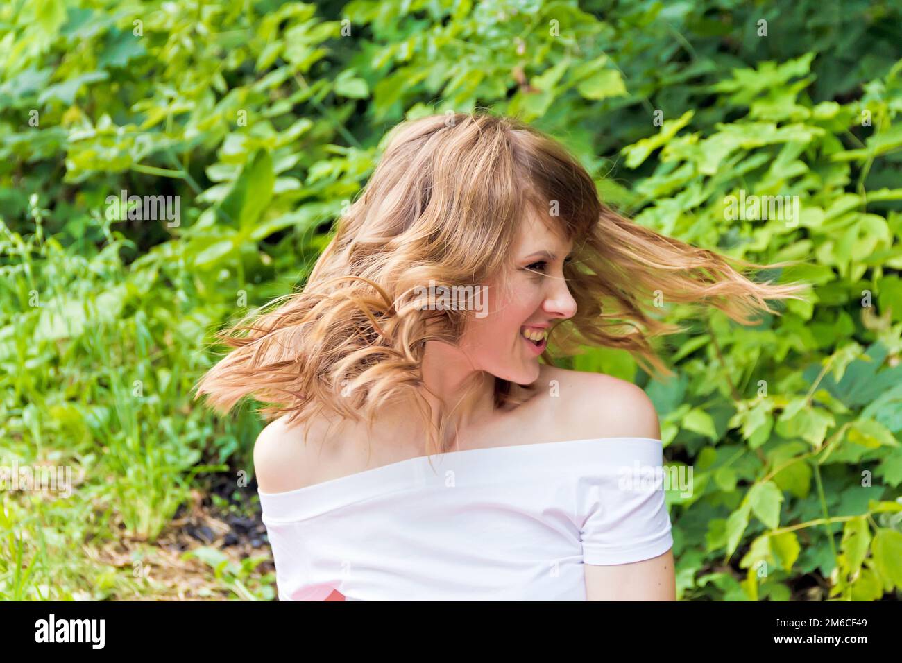 Playing with hair hi-res stock photography and images - Alamy