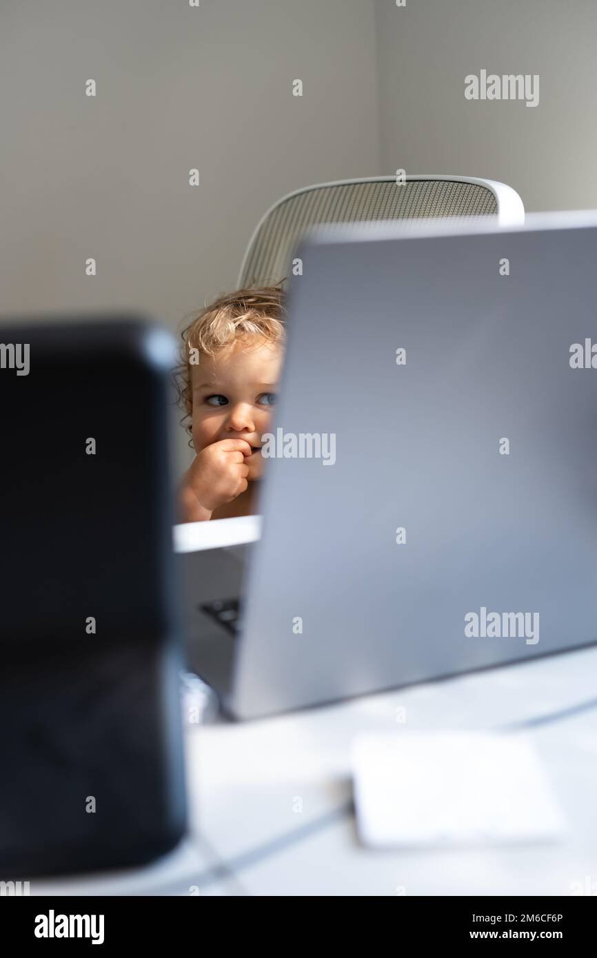 Cute baby boy with laptop computer on the table Stock Photo - Alamy