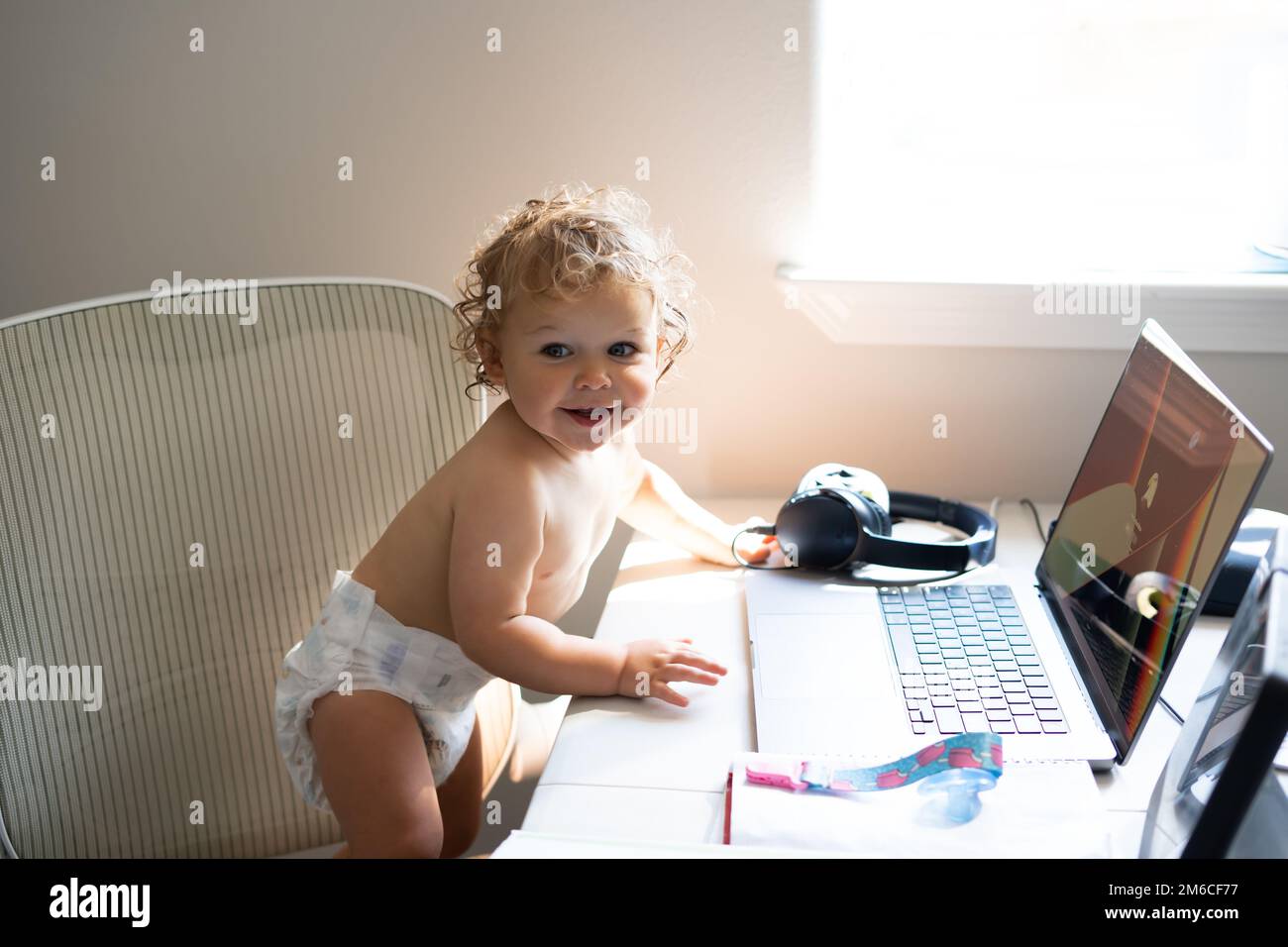 Cute baby boy with laptop computer on the table Stock Photo - Alamy
