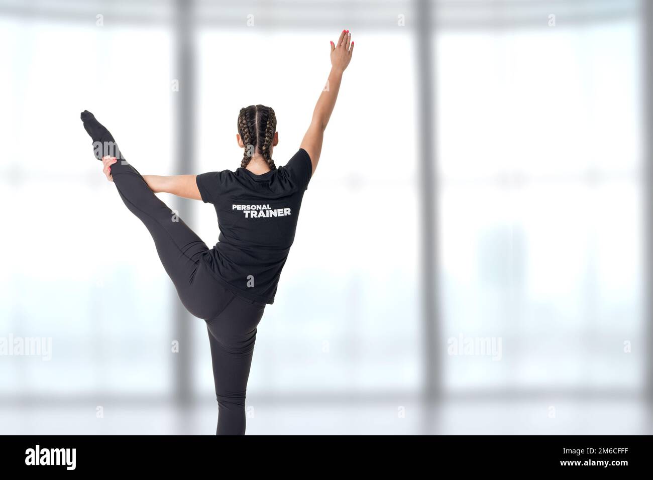 Woman Standing With One Leg Up Stock Photo - Alamy