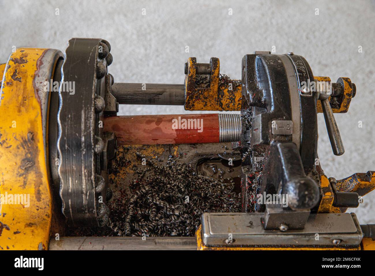 iron pipe beveling machine. Technician is Grooved Steel pipe. Fire ...