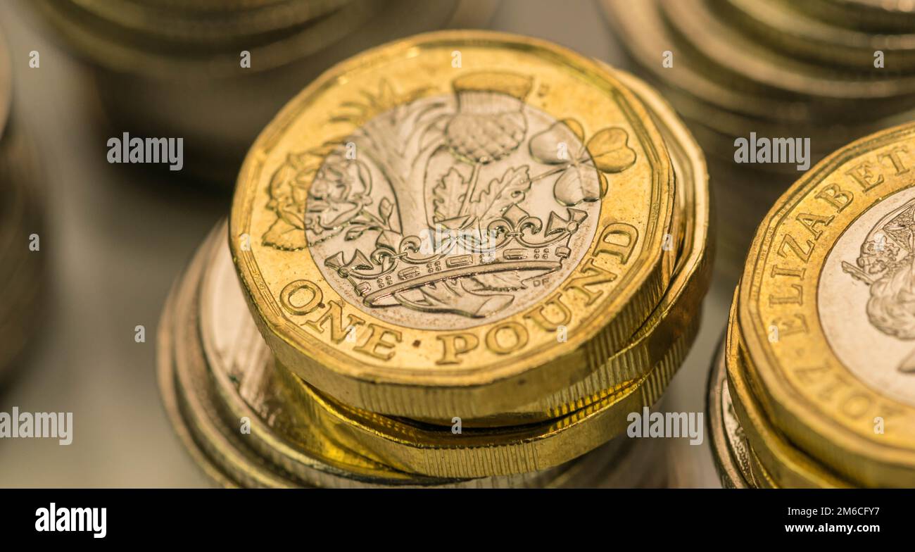 Close up focus photos of new United kingdom Pound coin, among other ...