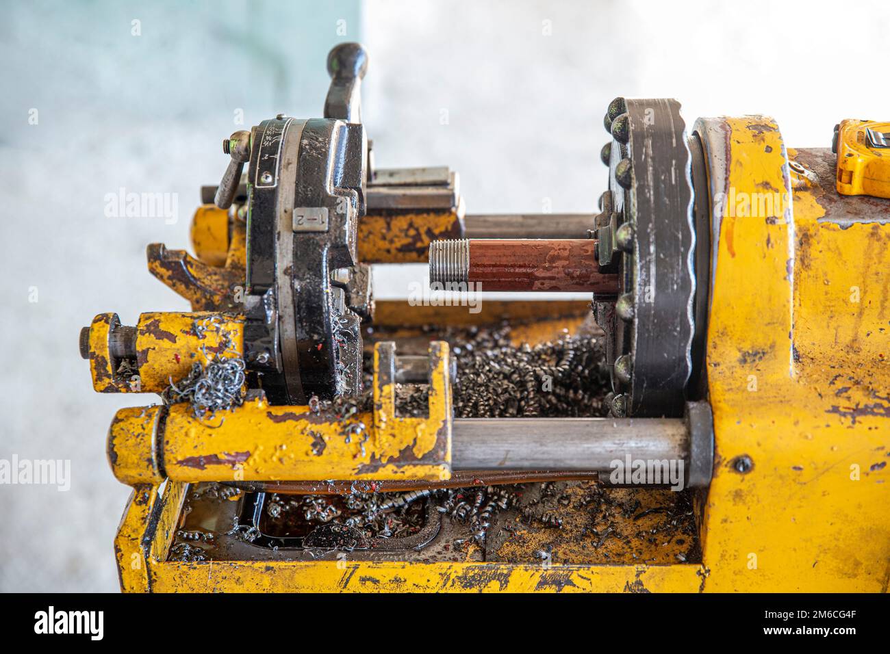 iron pipe beveling machine. Technician is Grooved Steel pipe. Fire ...