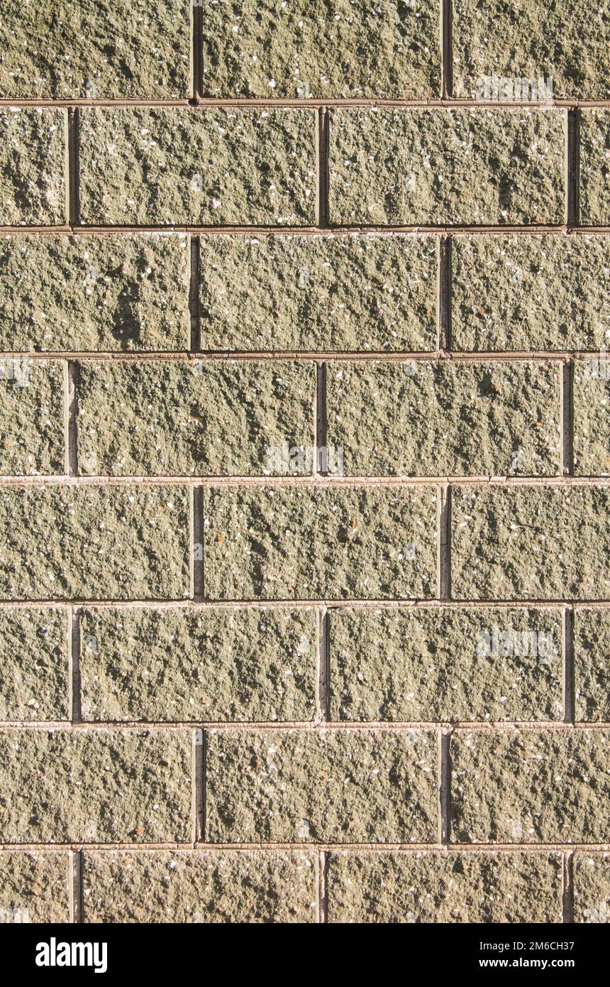 Wall of green decorative brick Stock Photo - Alamy