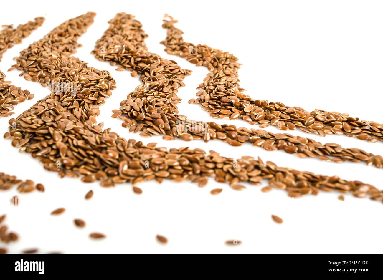 Creative layout made of organic flax seeds isolated on white background ...