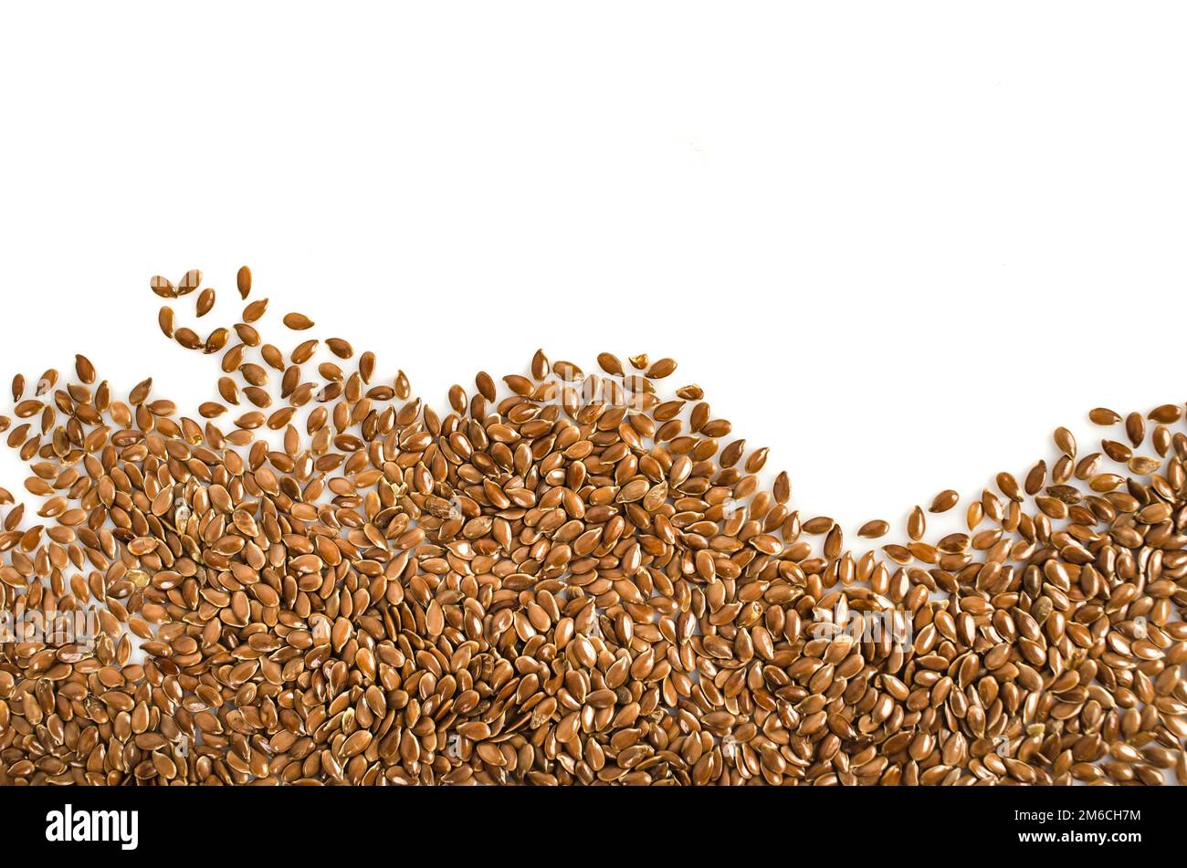 Creative layout made of organic flax seeds isolated on white background. Flat lay. Food concept ...