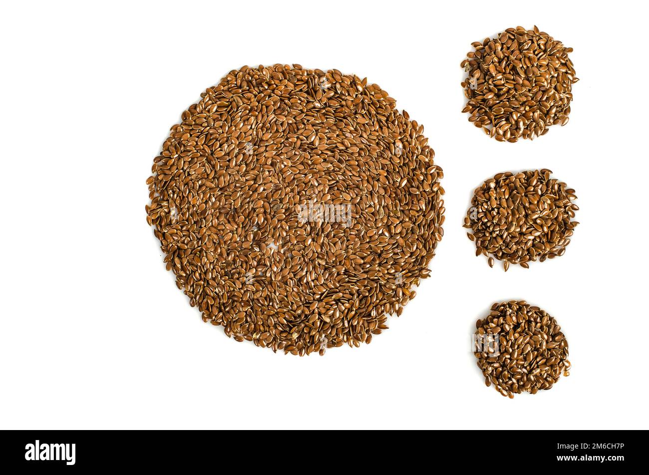 Creative layout made of organic flax seeds isolated on white background ...