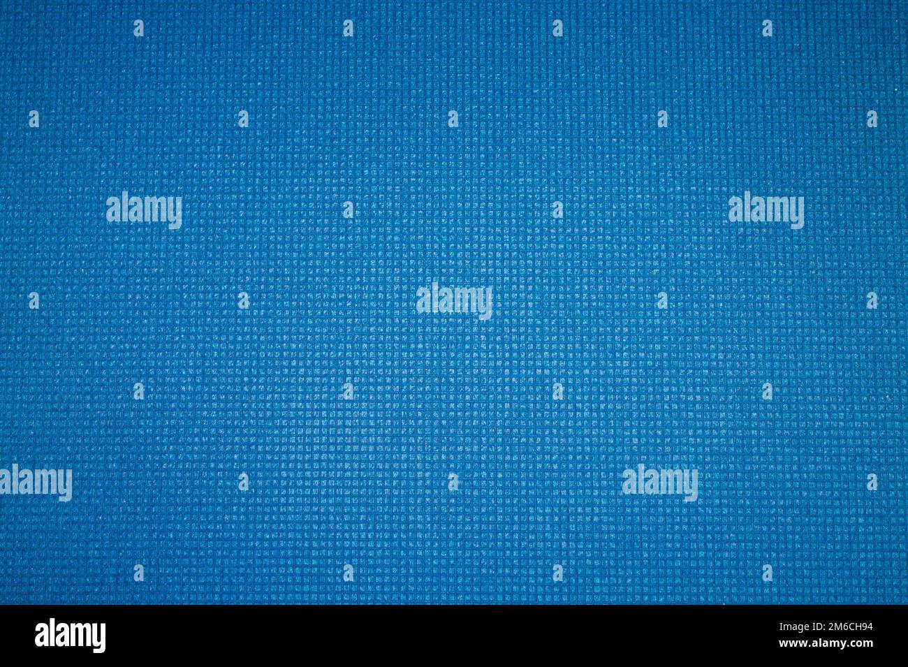 Blue background. Mat for sport, yoga and meditation Stock Photo - Alamy