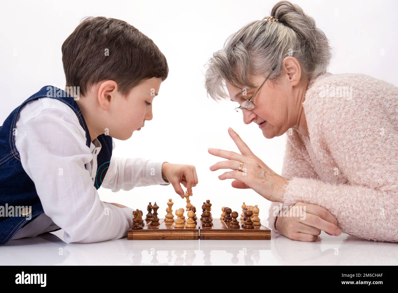 Chess between two generations Stock Photo - Alamy