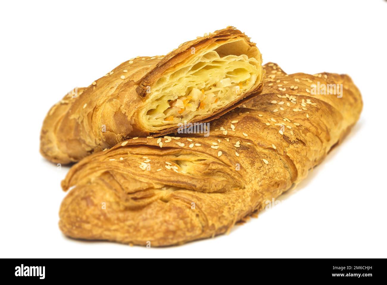 Cake of puff pastry with filling on white background, close-up, blur ...