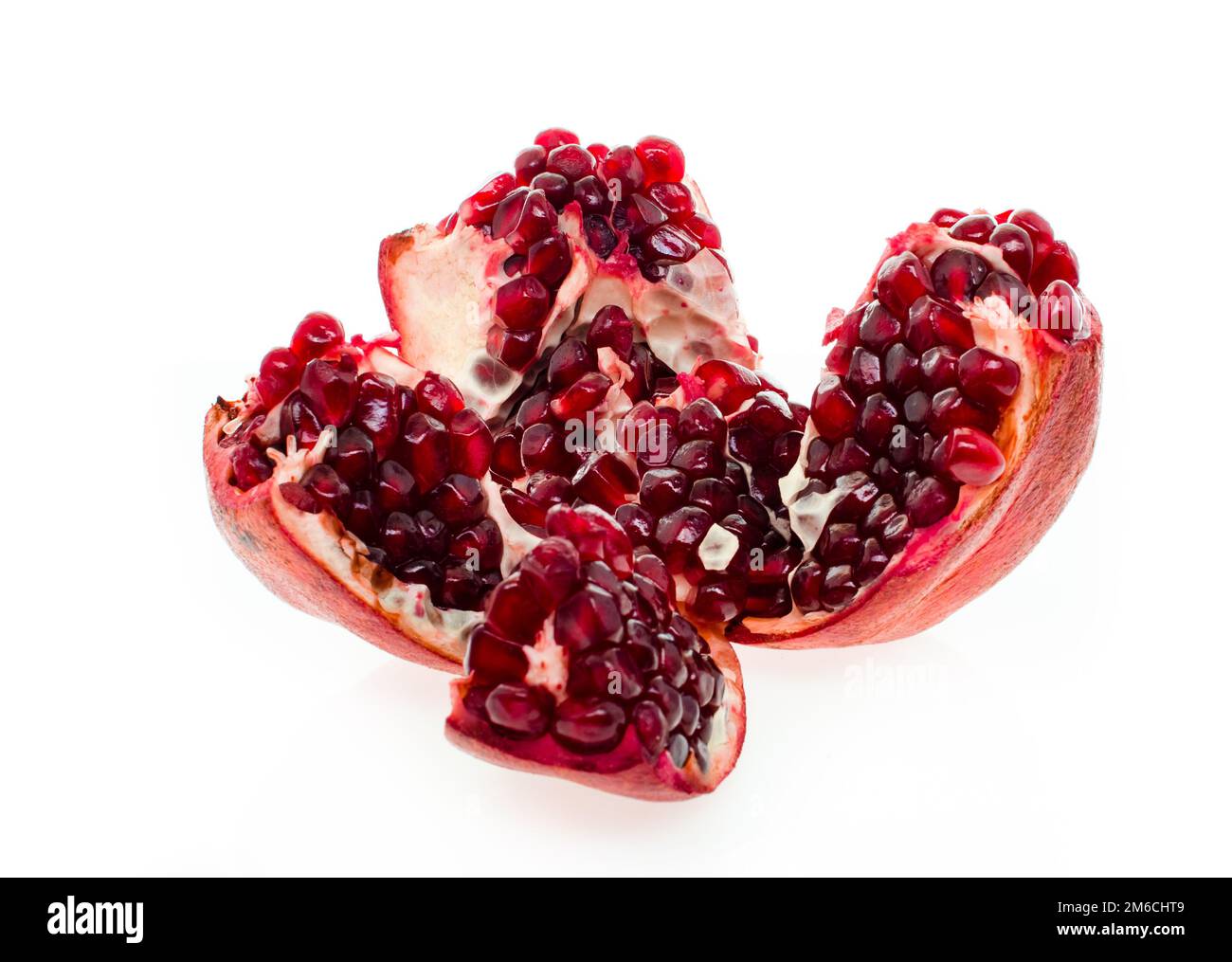 Open fresh ripe pomegranates on white isolated Stock Photo - Alamy