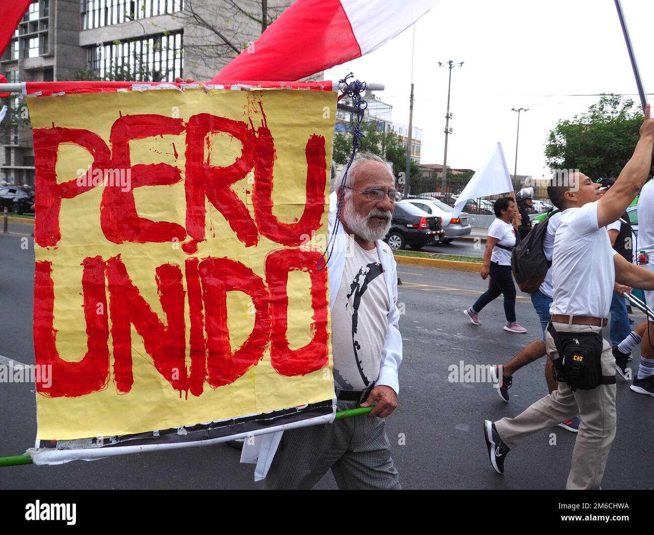 "United Peru" can be read in a banner when Hundreds march for peace in ...