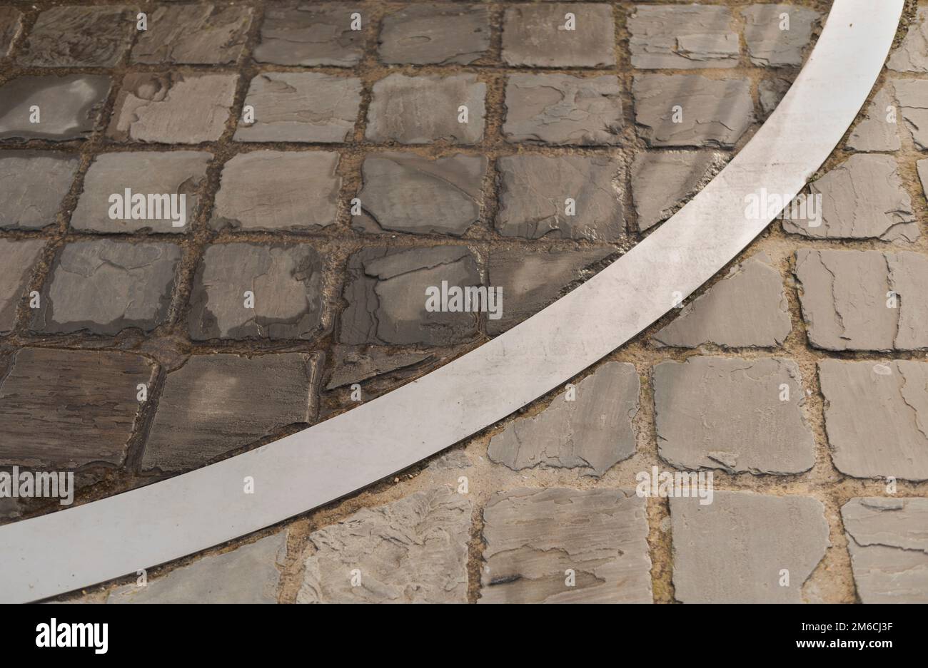 Metal arcuate insert into concrete pavement when laying vowels Stock ...