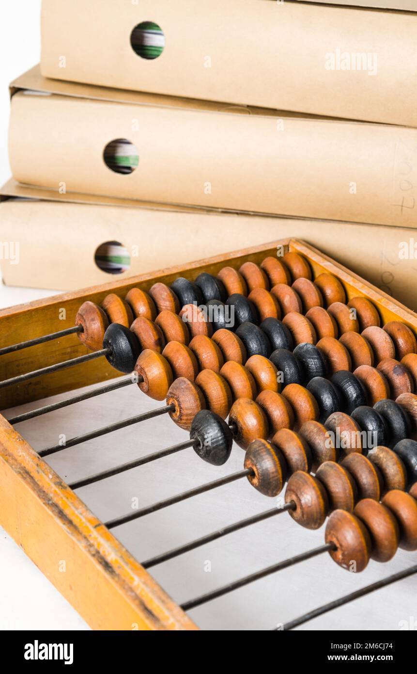 Old abacus and folders with documents, close-up isolated on white Stock ...