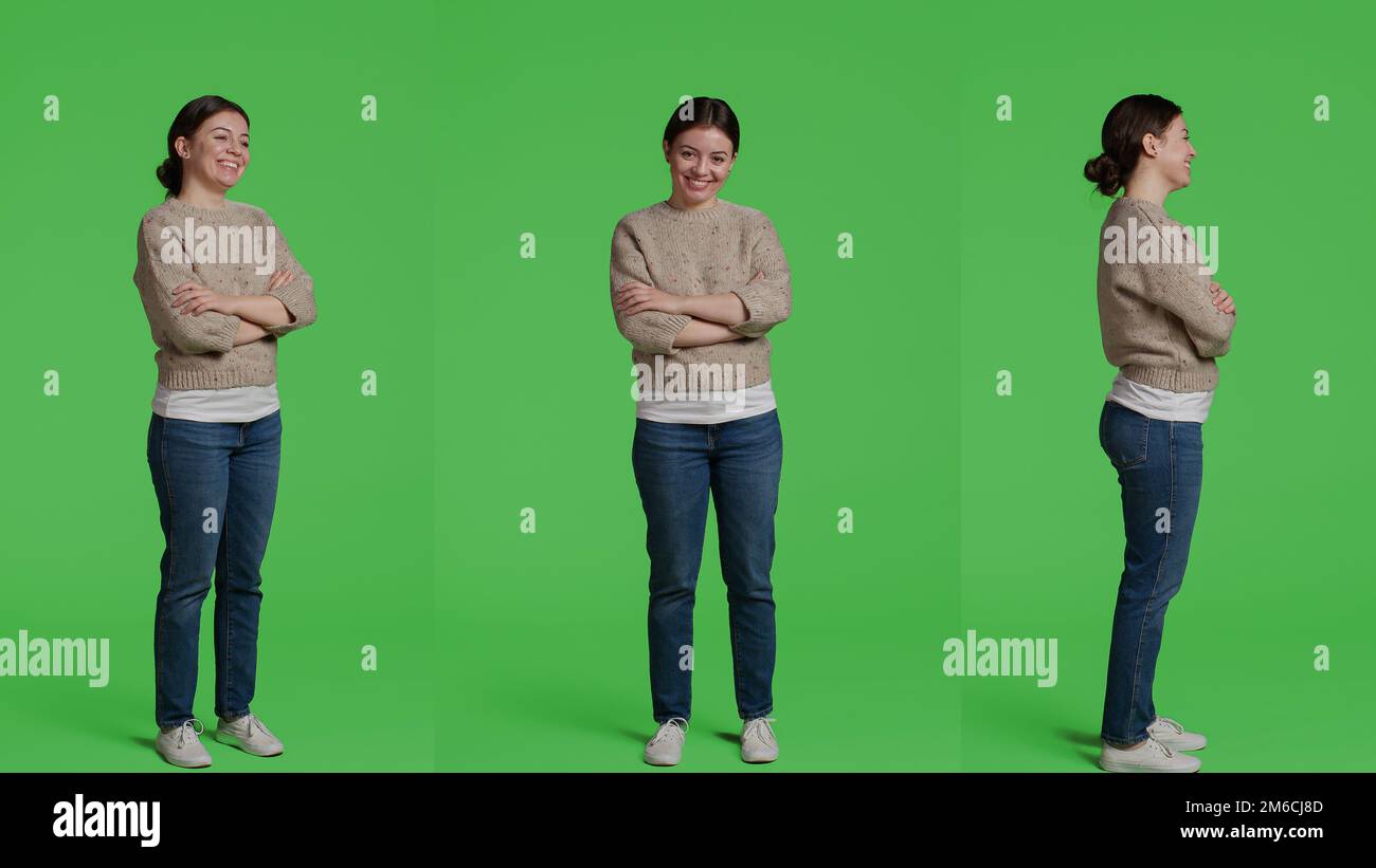 Young adult standing over full body greenscreen background, posing in ...