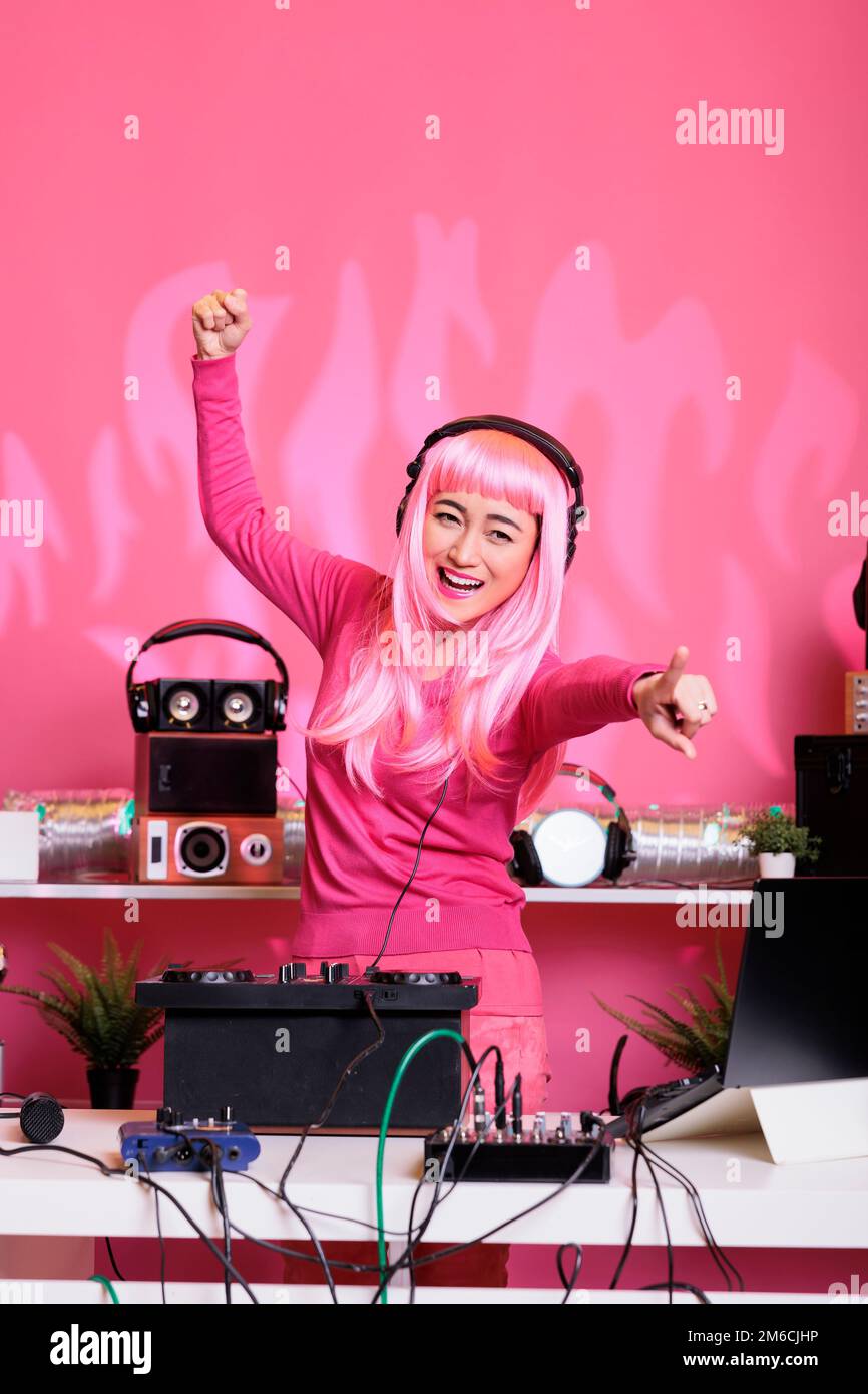 Musical artist playing mixing techno song with electronic using ...