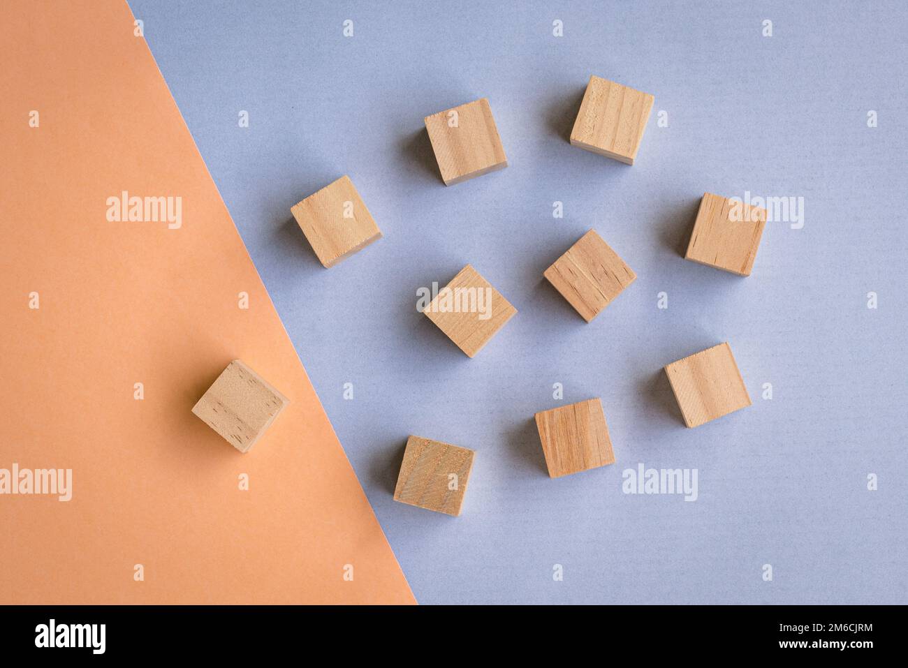 Wooden blocks on blue and oange background. Leadership, human resources ...