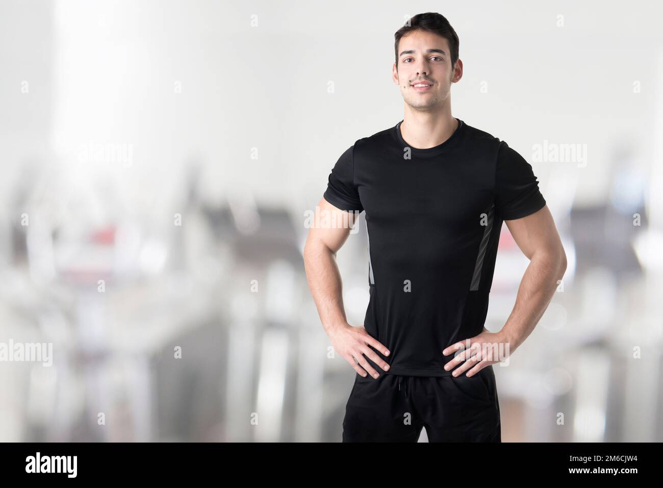 Personal Trainer With Hands on Waist Stock Photo - Alamy