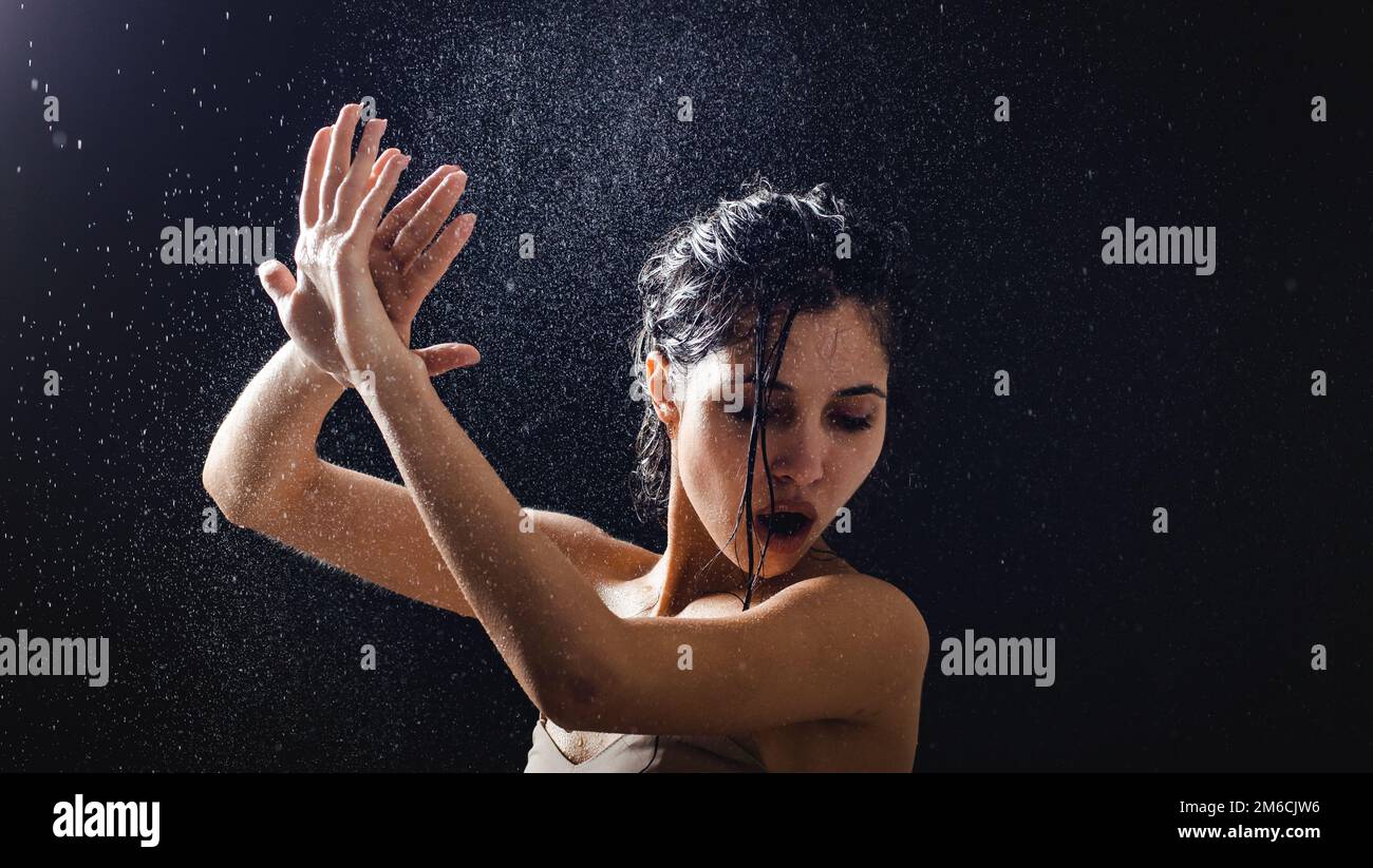Young girl portrait and splashing water in her face. beautiful female ...