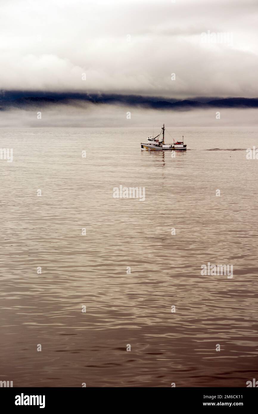 Lone Fishing Boat Motors Out Strait Heading to See Stock Photo - Alamy