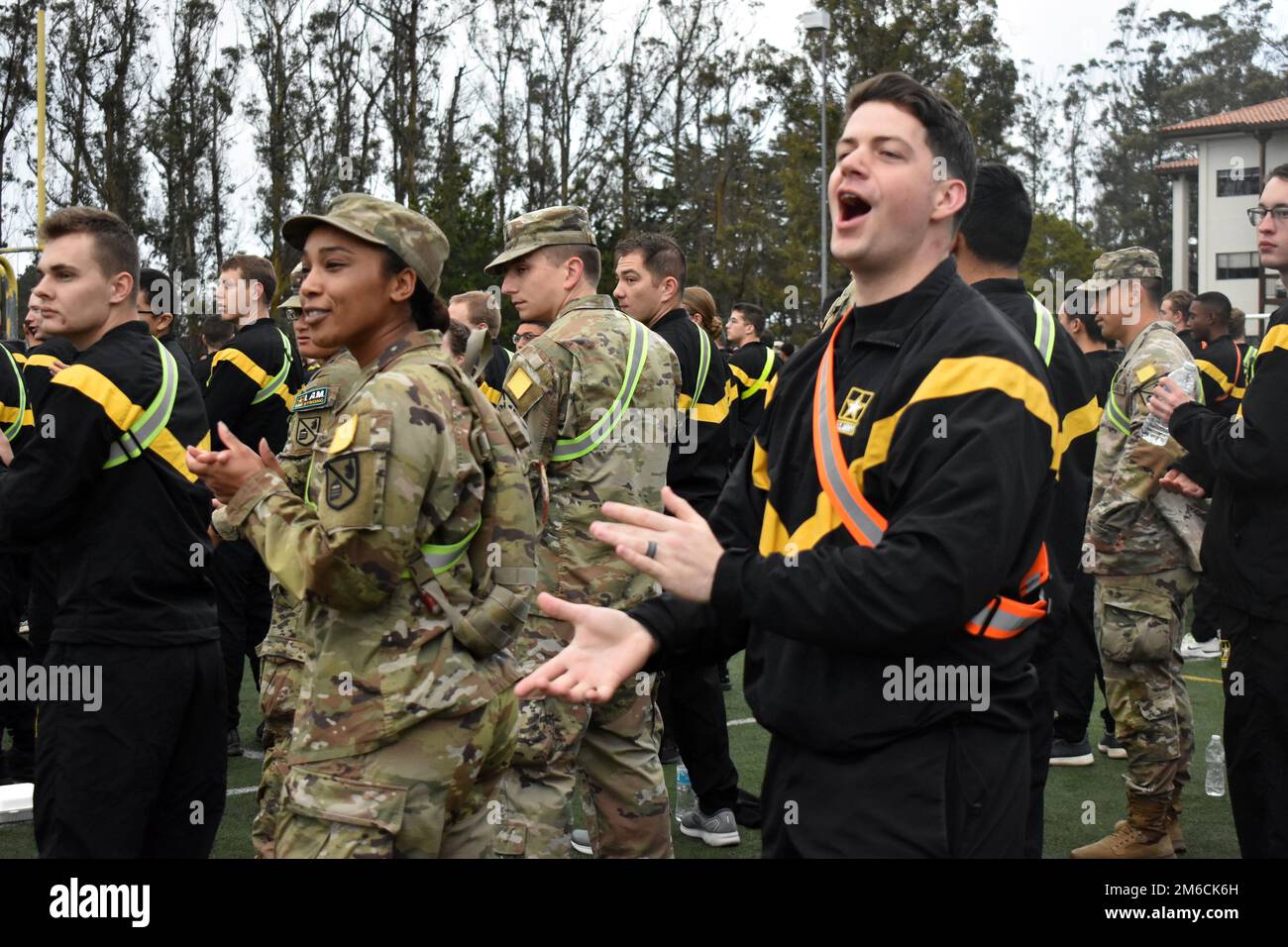Soldiers assigned to the 229th Military Intelligence Battalion cheer on ...