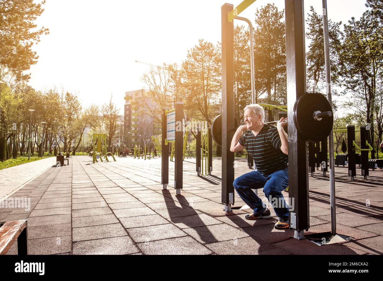 Senior man lifting weights hi-res stock photography and images - Alamy